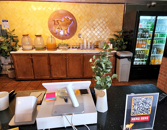The drink station offers liquid refreshment with the same golden pig logo&mdash;a reminder that even the beverages here are part of the experience.
