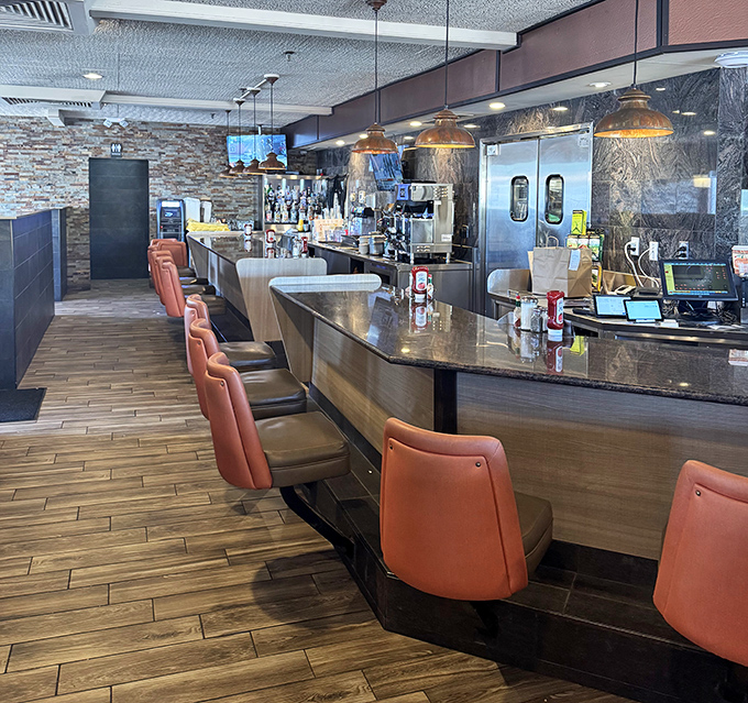 Counter seats&mdash;the front-row tickets to the culinary show&mdash;where regulars perch like oracles, dispensing wisdom on which pie slice reigns supreme today.