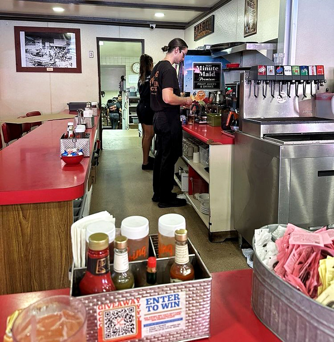 Where the magic happens: the counter area with its organized chaos and promise of caffeinated salvation.