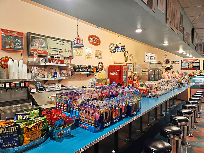 The soda fountain counter gleams with colorful temptations, a sugar-fueled time machine that transports you back to simpler, sweeter days.