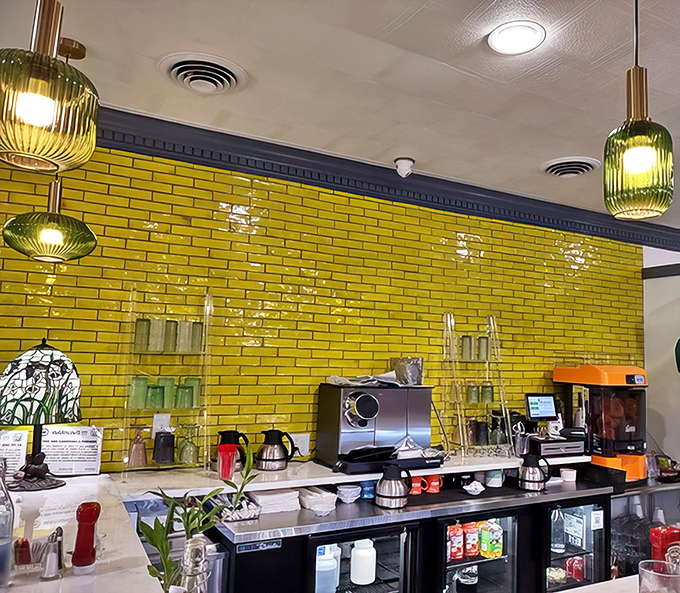 The bright yellow tile backsplash adds sunshine to the service area where breakfast dreams come true.