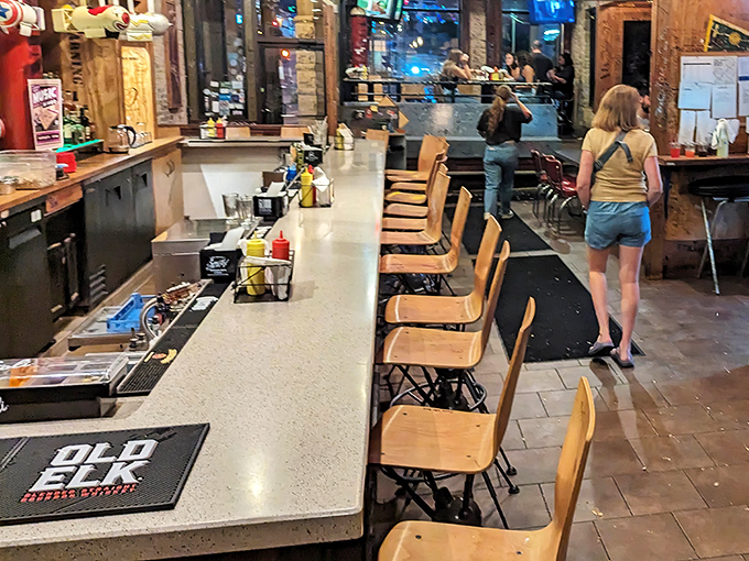 The counter seating offers front-row tickets to the culinary show, where you can witness the careful choreography of burger-flipping professionals at work.