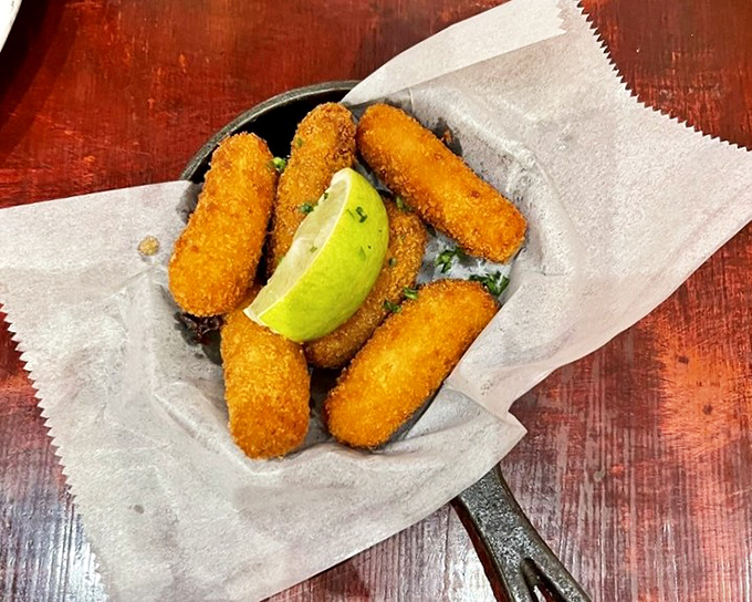 Golden croquettes with a lime wedge crown—crispy on the outside, creamy on the inside, and gone in sixty seconds.