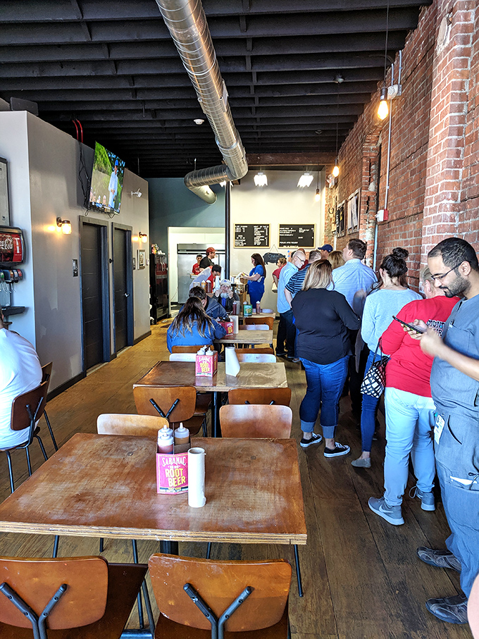 The line forms early and with purpose—these barbecue pilgrims understand that greatness requires both patience and strategic arrival times.