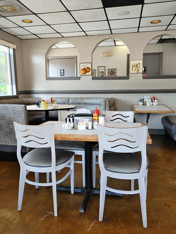 Arched cutouts and simple decor create separate dining spaces while maintaining that communal feeling that makes diners special.