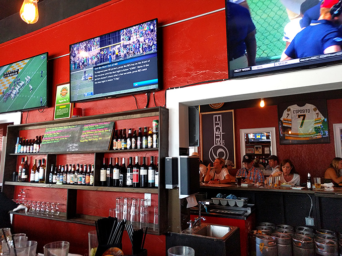 The red walls and multiple screens create the perfect backdrop for sporting events and the sport of serious eating.