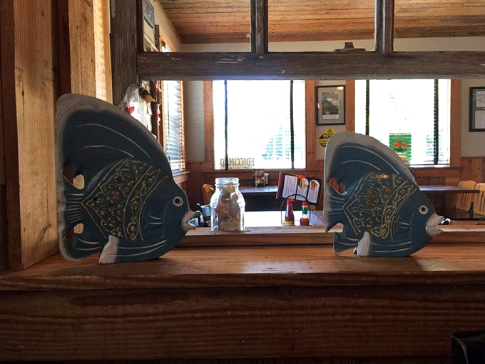 Whimsical fish decorations watching over diners like aquatic guardians. They've seen countless seafood feasts and keep all the secrets.
