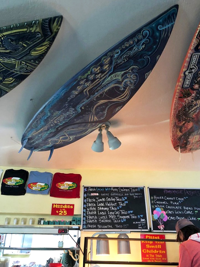 Artistically painted surfboards create a ceiling gallery that celebrates California's dual obsessions: ocean sports and exceptional food.