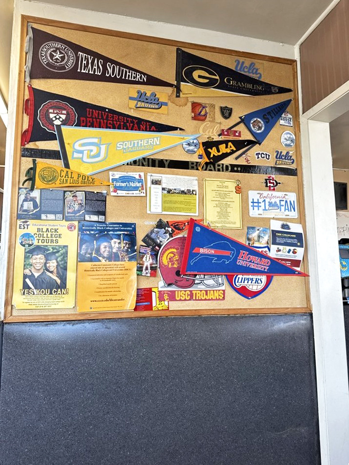 The wall of college pennants and memorabilia tells stories of community connections and hometown pride spanning generations.