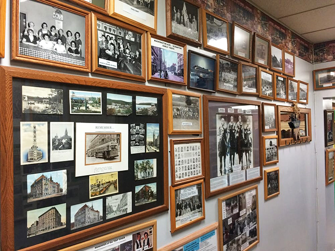 The wall of history tells stories of the community through decades of photographs, creating a museum of memories alongside your meatloaf.