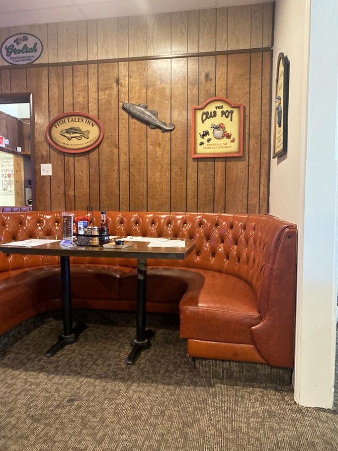 Nautical nostalgia lines the wood-paneled walls, creating the kind of old-school ambiance that chain restaurants spend millions trying to replicate.