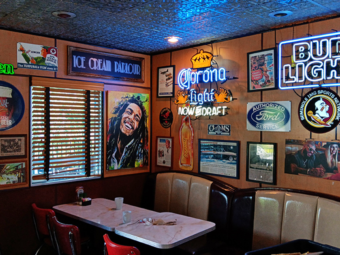 The walls tell stories through neon signs and memorabilia&mdash;a booth where you could easily lose track of time while solving the world's problems.