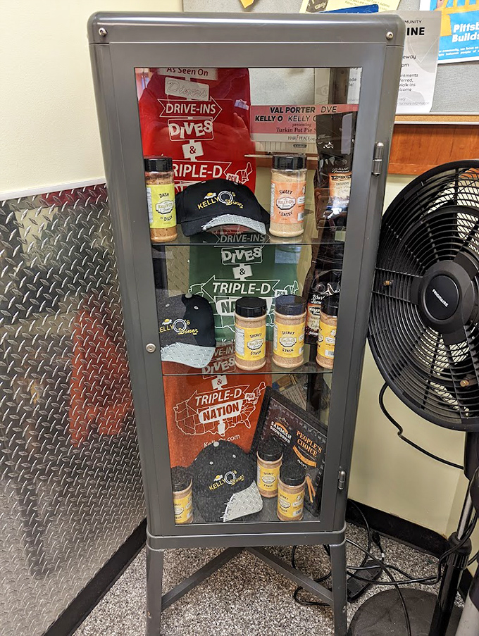 The merch cabinet&mdash;proof you're not just eating at Kelly O's, you're joining a movement. Those seasoning bottles are calling your name.