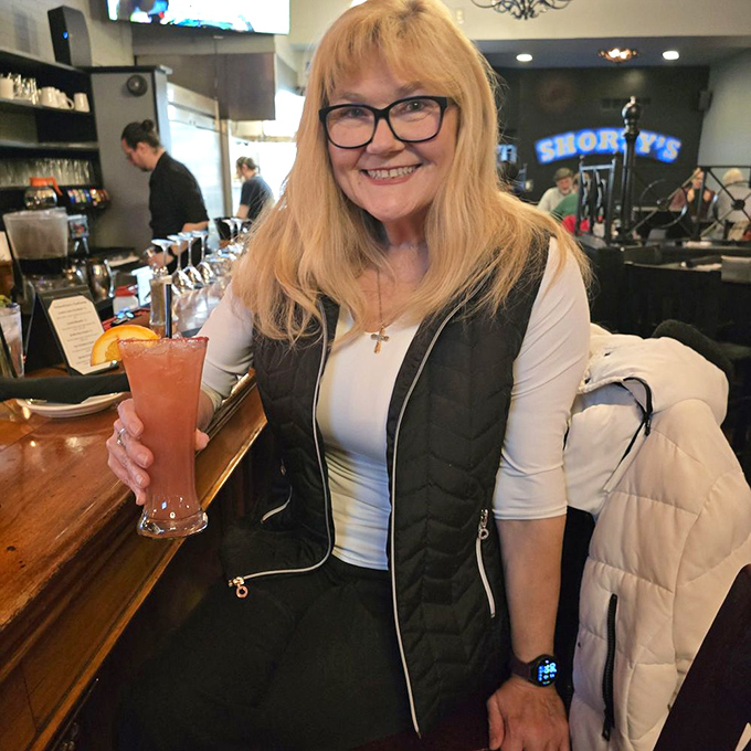 Nothing says "I've discovered something wonderful" quite like that smile and a perfectly crafted cocktail in hand.