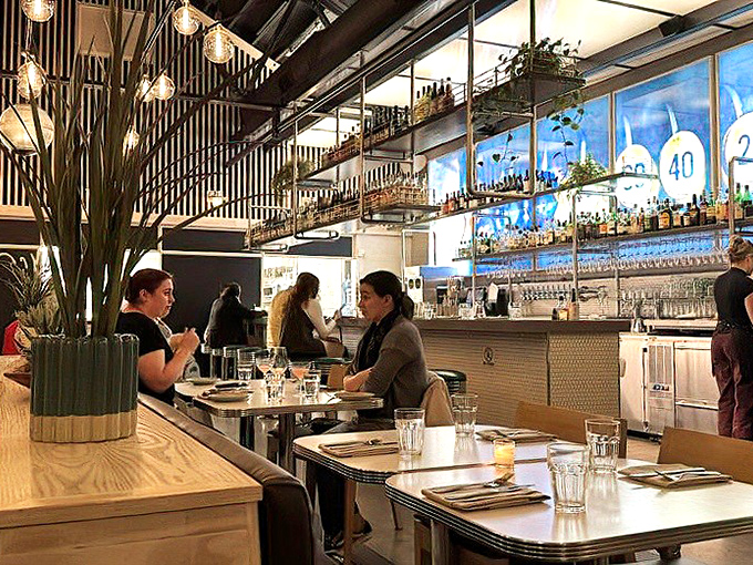 The dining room hums with the universal language of satisfaction&mdash;forks pausing mid-air as diners savor that perfect bite.