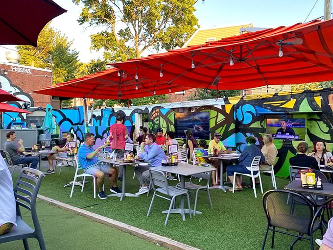 The outdoor patio buzzes with conversation and laughter. Under bright umbrellas, strangers become neighbors over plates of Cowboy comfort.
