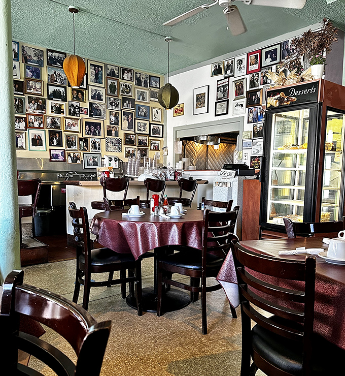 Tables draped in burgundy cloths create little islands of conversation in a sea of delicious aromas and clinking silverware.