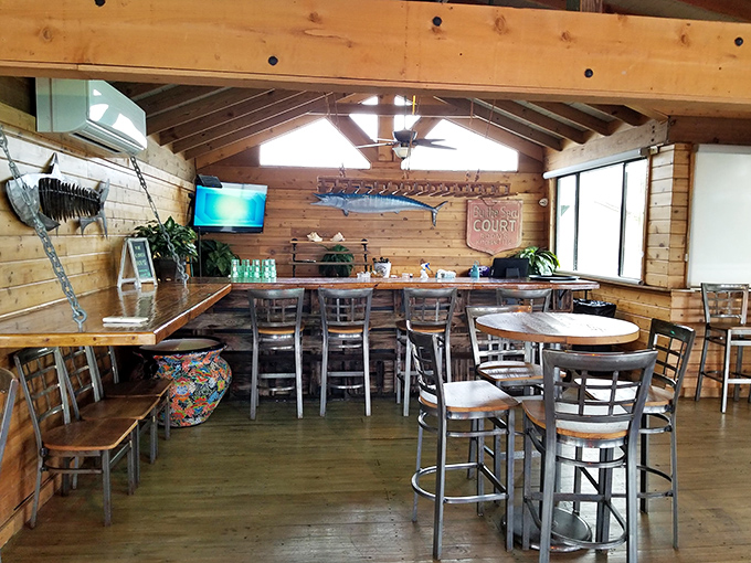 High-top seating and warm wood tones create a casual elegance that says, "Stay awhile, the ocean isn't going anywhere."