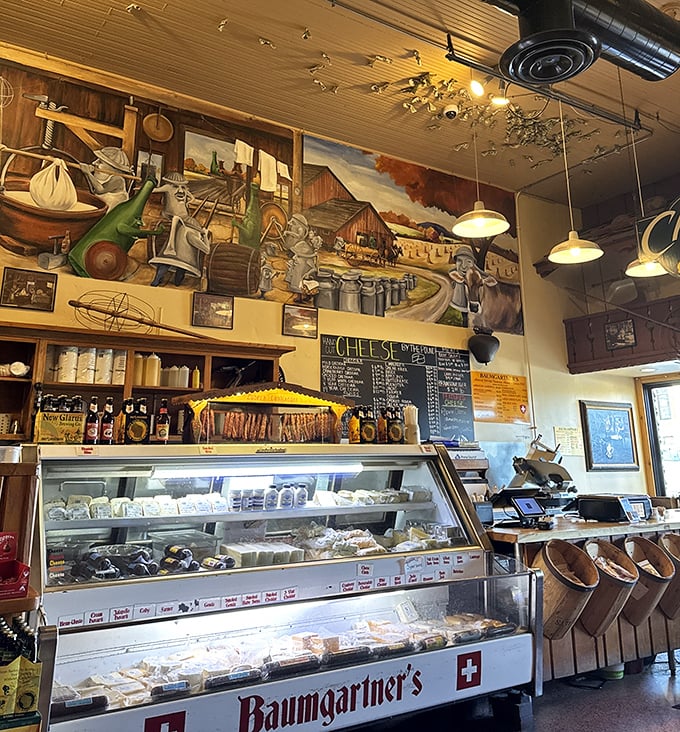Cheese heaven awaits! The display case showcases Wisconsin's dairy prowess while murals above celebrate the region's agricultural traditions.