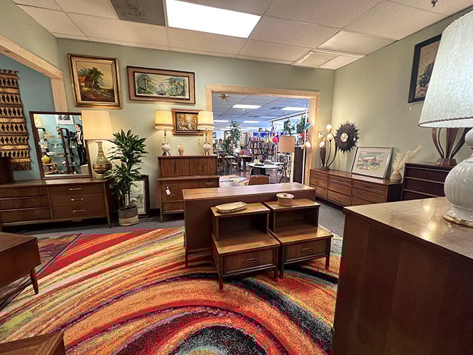 Wood tones and vibrant rugs playing together in perfect harmony, like the visual equivalent of a surprisingly successful fusion restaurant.