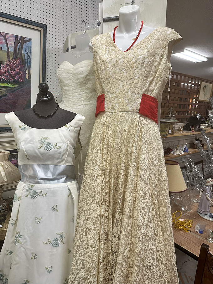 Elegant vintage gowns await their next dance, their fabrics whispering tales of proms, weddings, and evenings when dressing up was an art form.