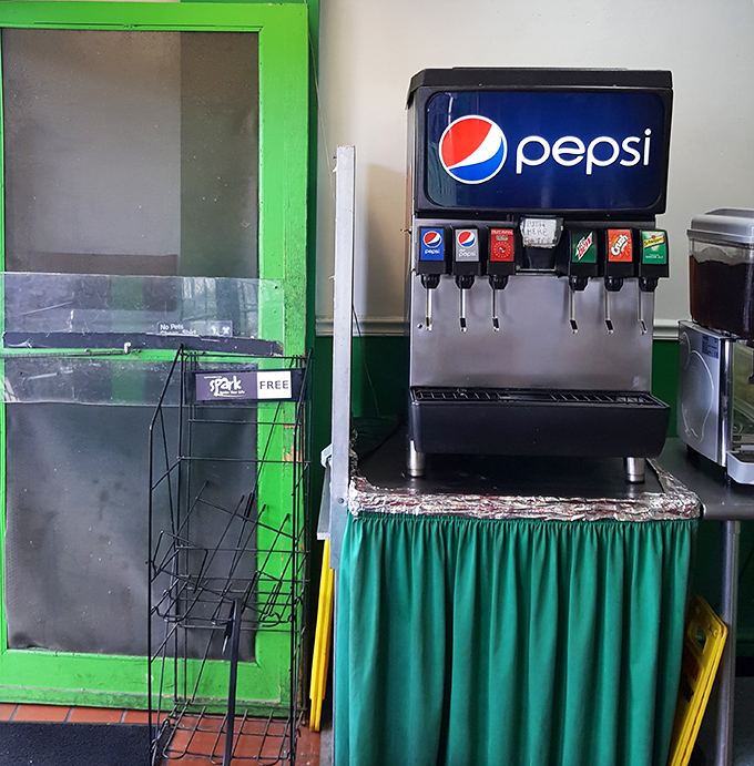 The soda fountain station stands ready to complement your meal with the perfect fizzy companion to cut through that delicious richness.