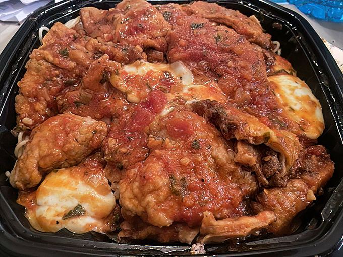 Italian-American comfort in takeout form. This chicken parmesan doesn't just satisfy hunger – it creates food memories that linger for days.