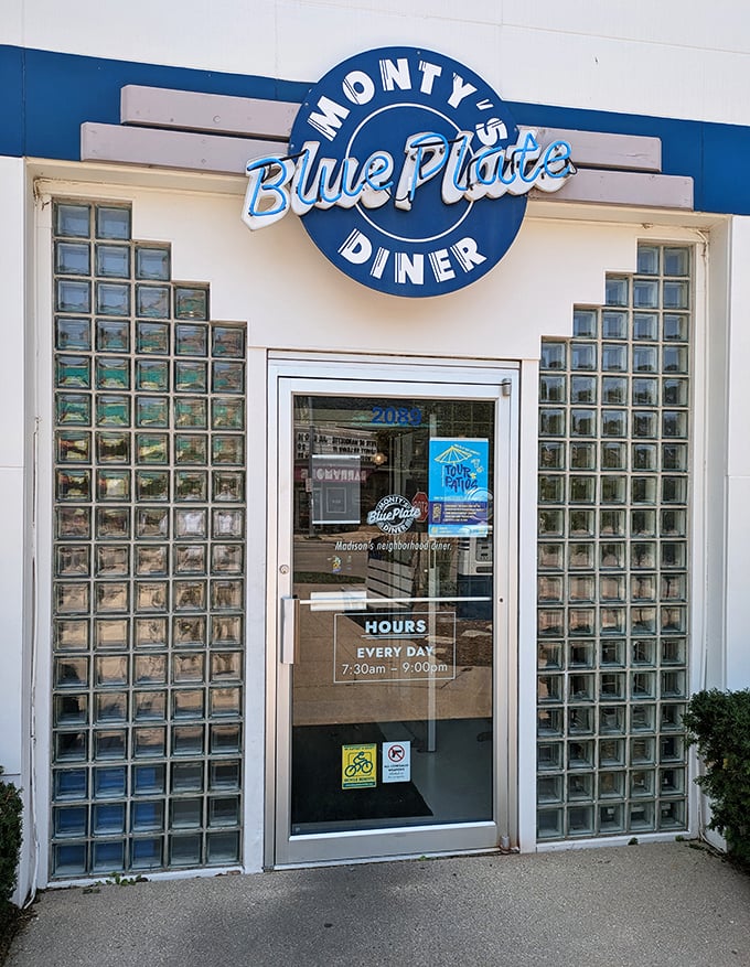 The entrance, flanked by glass blocks catching morning light, promises the kind of meal that makes you plan your next visit before you've finished the first.
