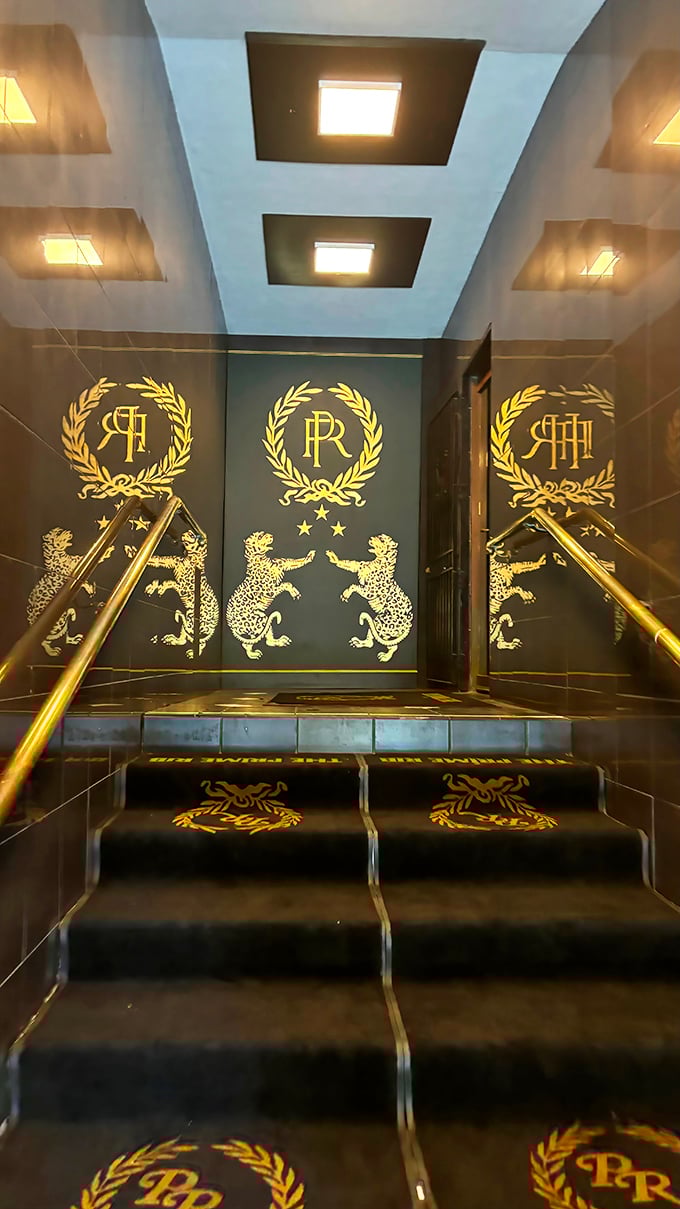 Gold leopards guard the entrance like this is Fort Knox for flavor. The stairway to heaven, if heaven were made of prime beef.