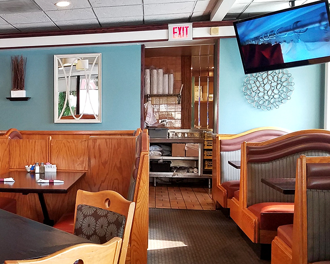 A glimpse into the heart of the restaurant, where wooden booths frame countless conversations and shared meals.