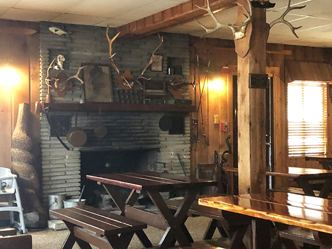 The rustic fireplace corner feels like the living room of that fishing-obsessed uncle everyone wishes they had.