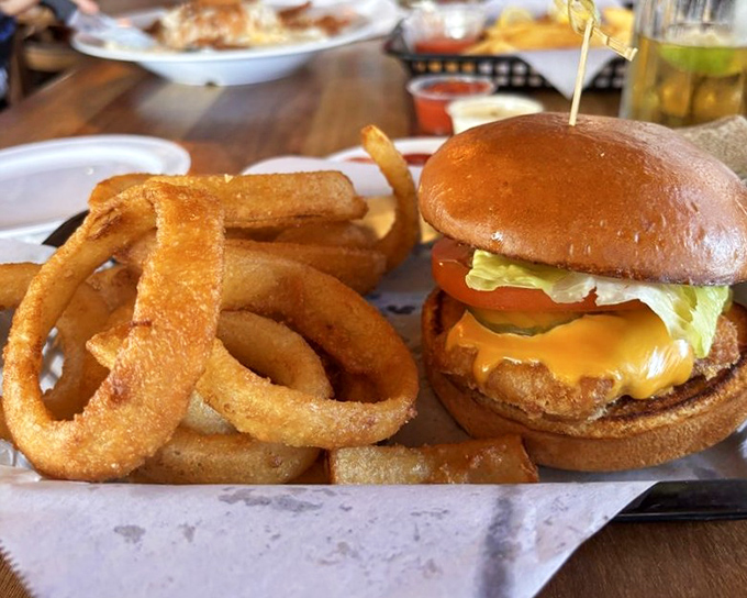 A burger that could convert vegetarians, flanked by onion rings so perfect they deserve their own Instagram account.