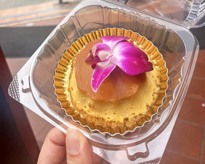 Flan so smooth it could run for office &ndash; topped with an orchid that's purely decorative, not edible.