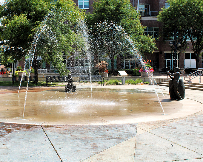 Children's laughter mingles with splashing water at this downtown fountain, where sculptural elements celebrate Moline's playful spirit.