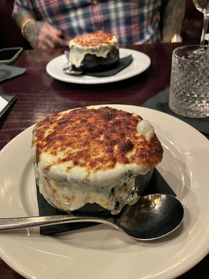 French onion soup with a cheese cap so magnificent it deserves its own superhero movie. The ultimate comfort in a crock.