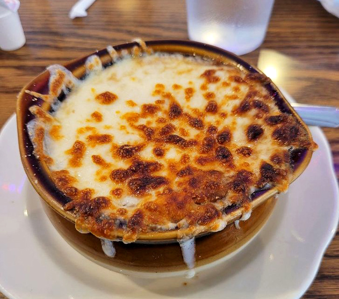 French onion soup that doesn't just warm your stomach but hugs your soul—that cheese pull could win Olympic medals.