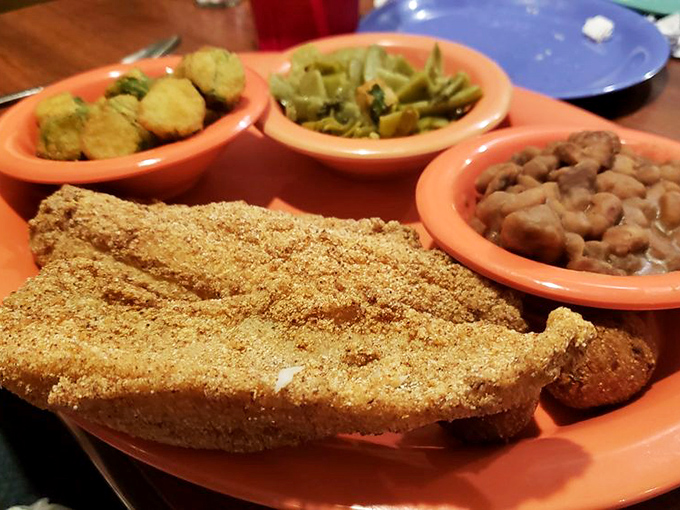 The catfish that launched a thousand road trips. That golden cornmeal coating holds secrets that fancy restaurants would pay good money to discover.