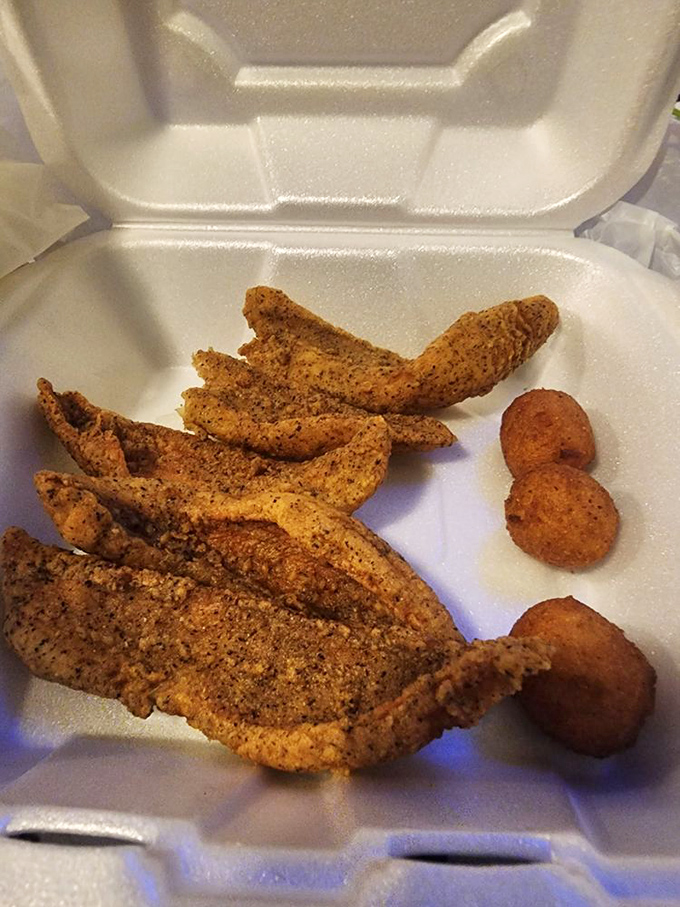 Take-out perfection: golden-fried fish fillets with hush puppies. The kind of meal that makes your car smell amazing all the way home.