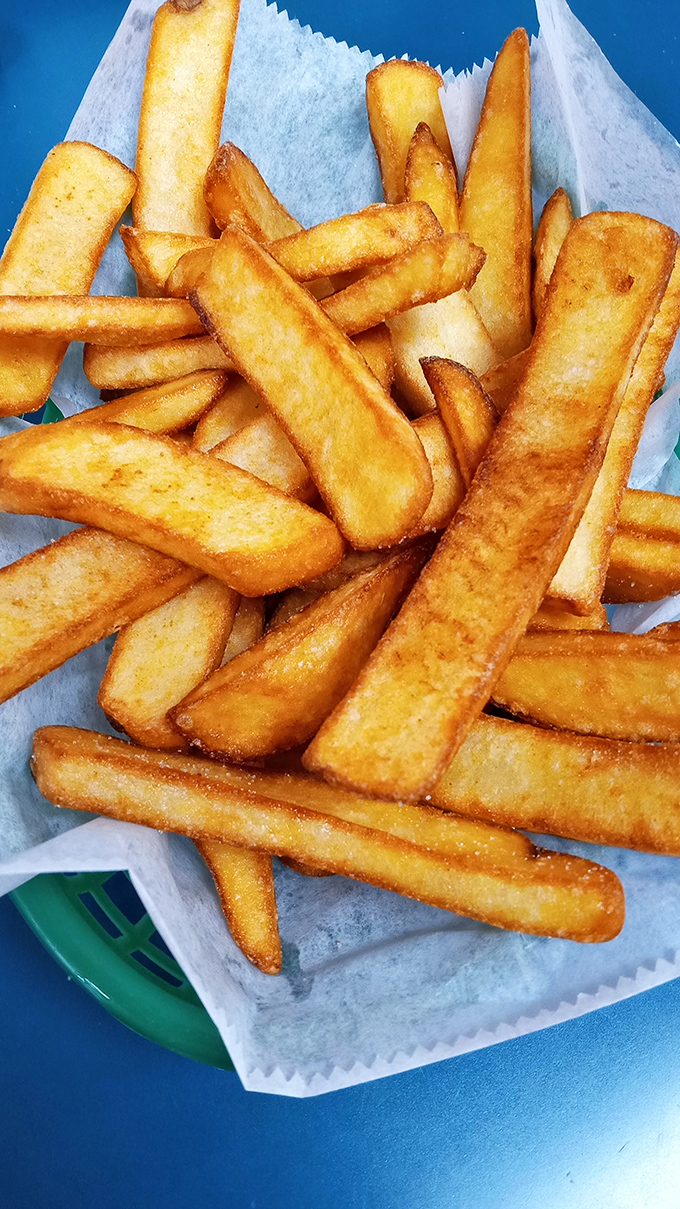 These aren't just fries—they're golden wands of potato perfection. Crispy exteriors giving way to fluffy interiors, they're the supporting actors who steal the show.