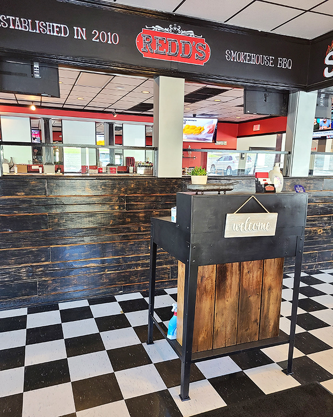 A welcoming front desk that sets the tone for the exceptional barbecue experience waiting inside.