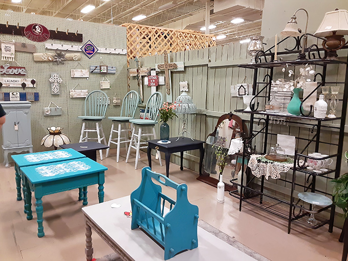 Coastal chic meets farmhouse fancy in this carefully curated furniture display. That turquoise table is calling your name!