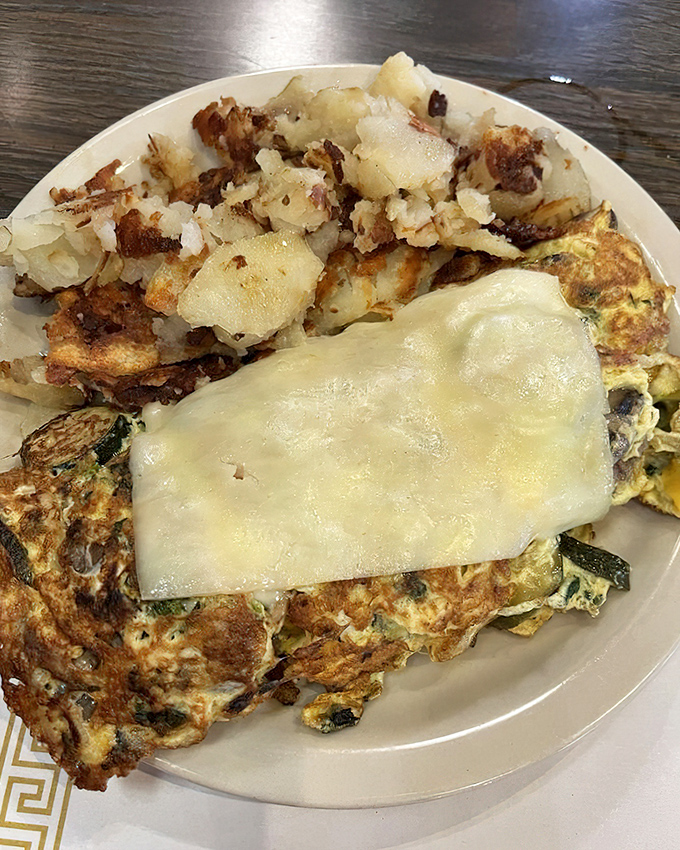 This veggie-packed omelet with crispy potatoes proves healthy-ish can still be delicious. The melted cheese blanket on top seals the deal.