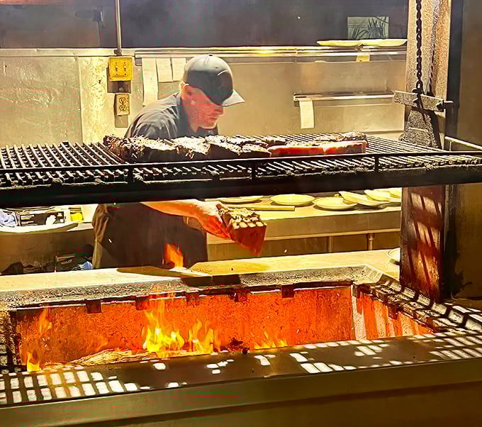 Watch the master at work&mdash;those adjustable grills over glowing oak coals represent steak science that no culinary school can teach.