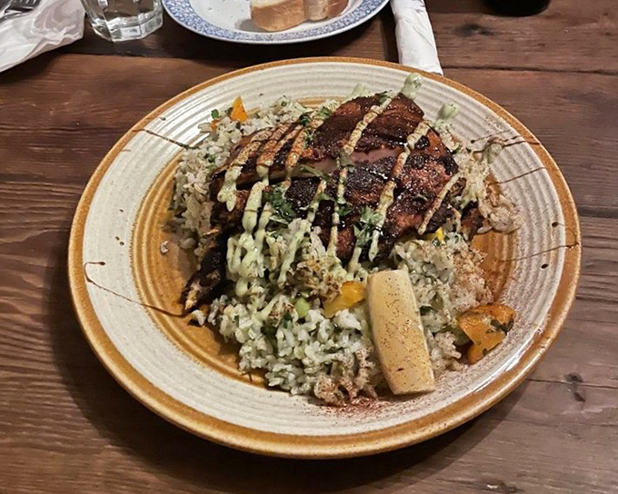This isn't just fish over rice&mdash;it's a perfectly cooked piece of halibut, seasoned and seared by someone who respects both the ingredient and the person about to enjoy it.