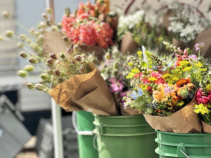 Fresh-cut flowers wrapped in simple brown paper remind us that in wine country, even the simplest pleasures come beautifully packaged.