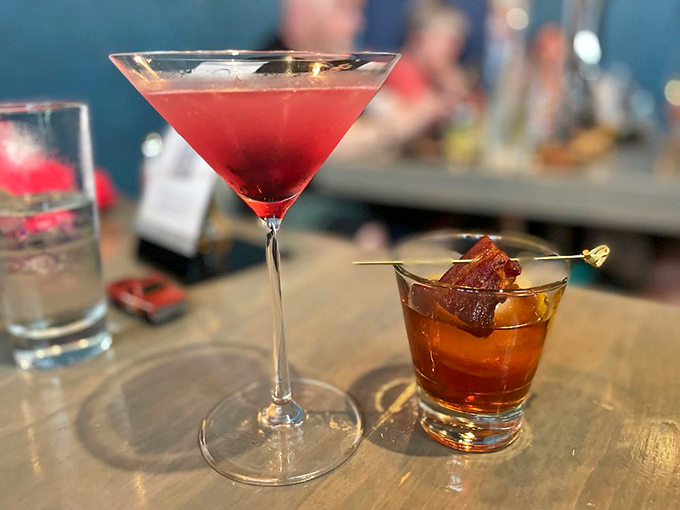 Cocktails that deserve their own spotlight. The ruby-red cosmo and old fashioned with candied bacon prove the bar program isn't just an afterthought.