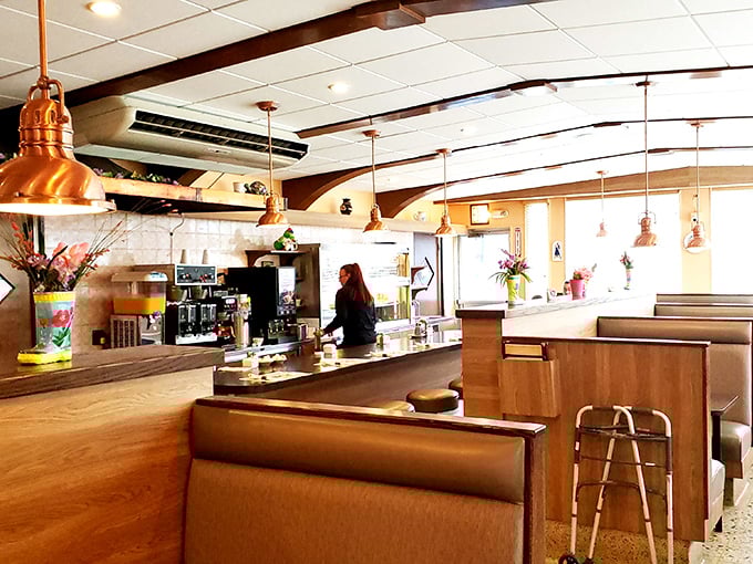 Copper pendant lights hang over booths that have witnessed first dates, family celebrations, and countless "just because" meals.