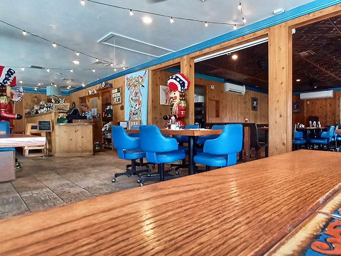 Blue chairs against wood paneling&mdash;Hickory Hollow's signature look combines comfort with no-nonsense authenticity.