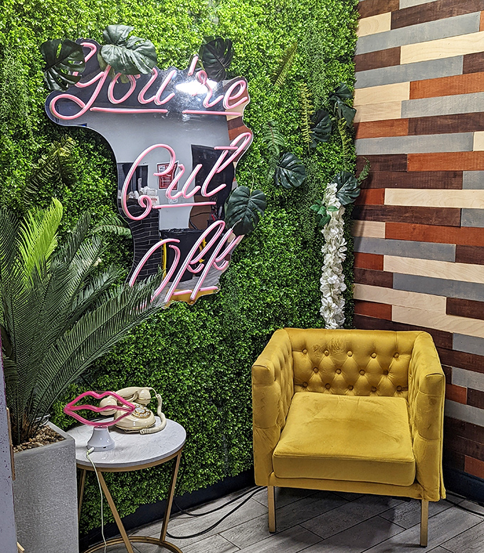 A neon "You're Cut Off" sign that's more playful than threatening. Against a living wall, this Instagram-worthy corner adds a touch of whimsy to your dining experience.