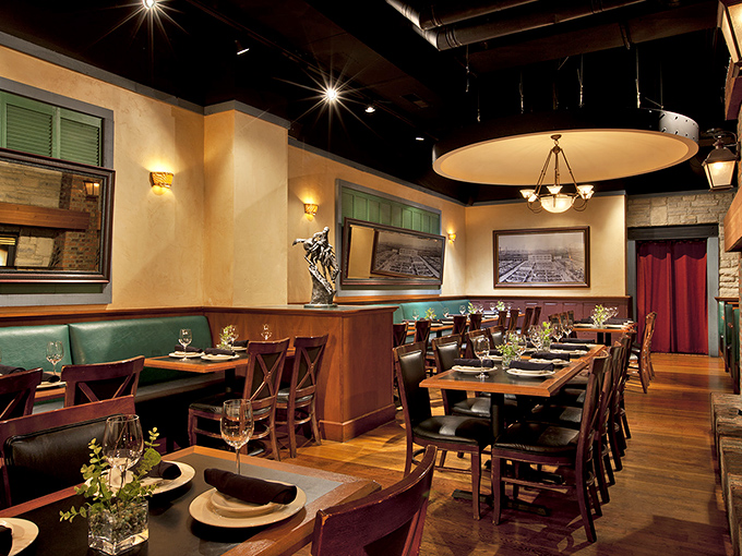 Earth tones, wood accents, and strategic lighting create an atmosphere that says, "Yes, you deserve this splurge" before you've even ordered.